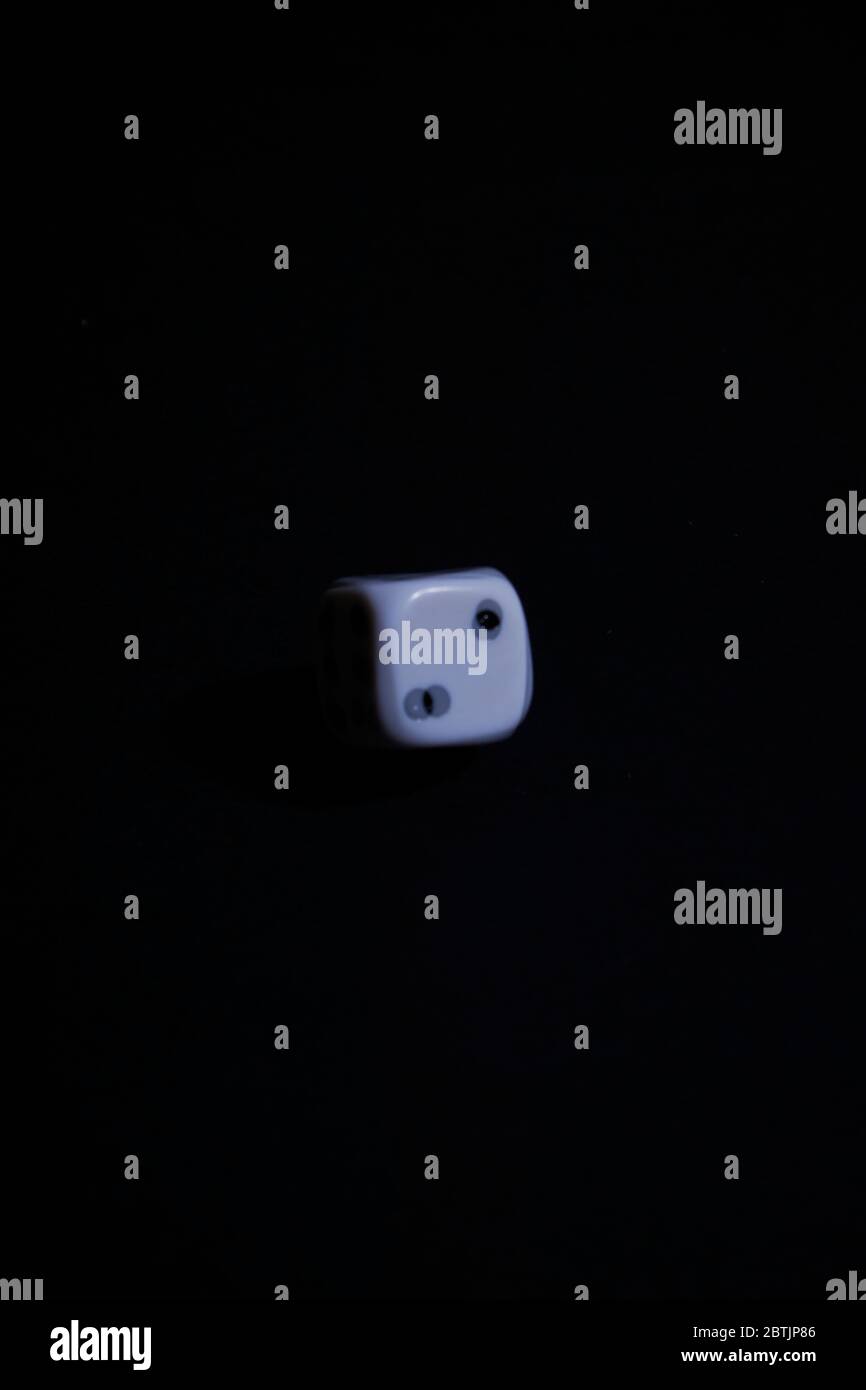 Dice, on black background, in motion, long exposure Stock Photo - Alamy