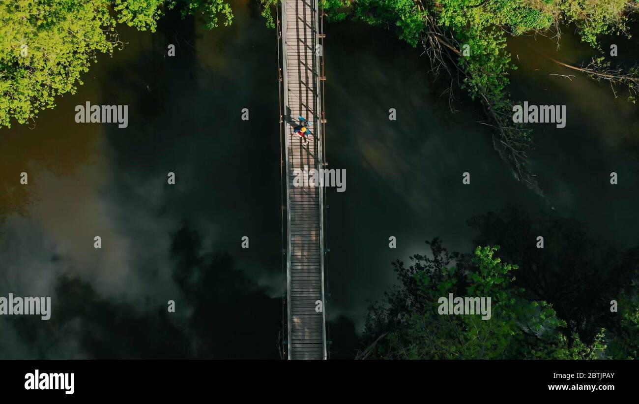 Aerial man walking on bridge hi-res stock photography and images - Alamy