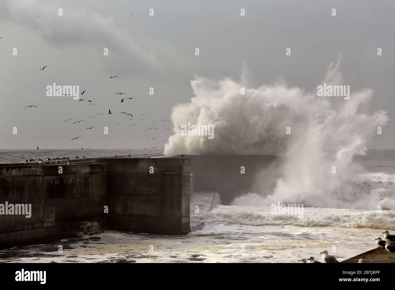 Stormy wave splash over pier Stock Photo - Alamy