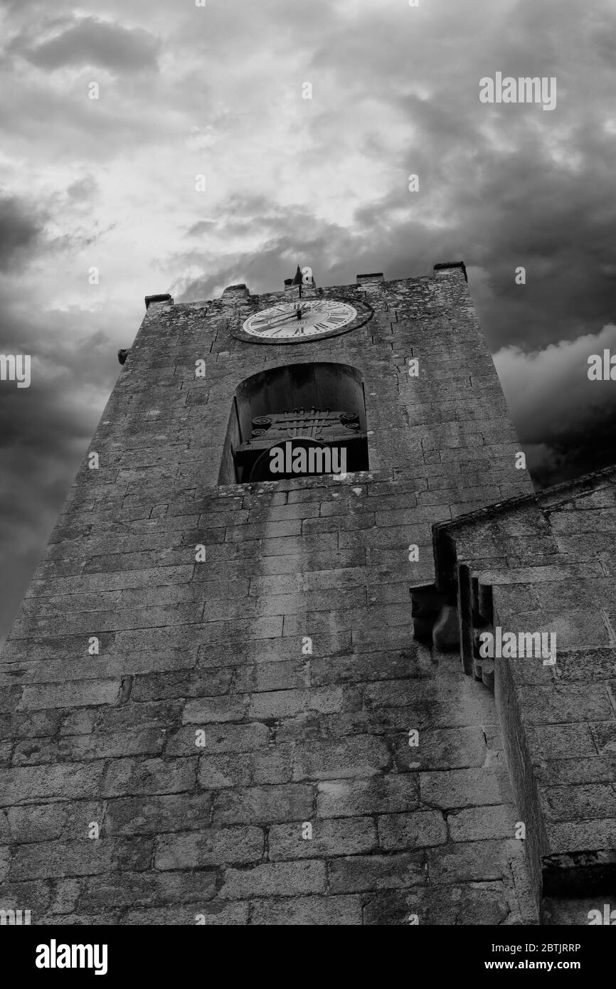 Old granite bell tower. Medieval city of Ponte de Lima, northern ...