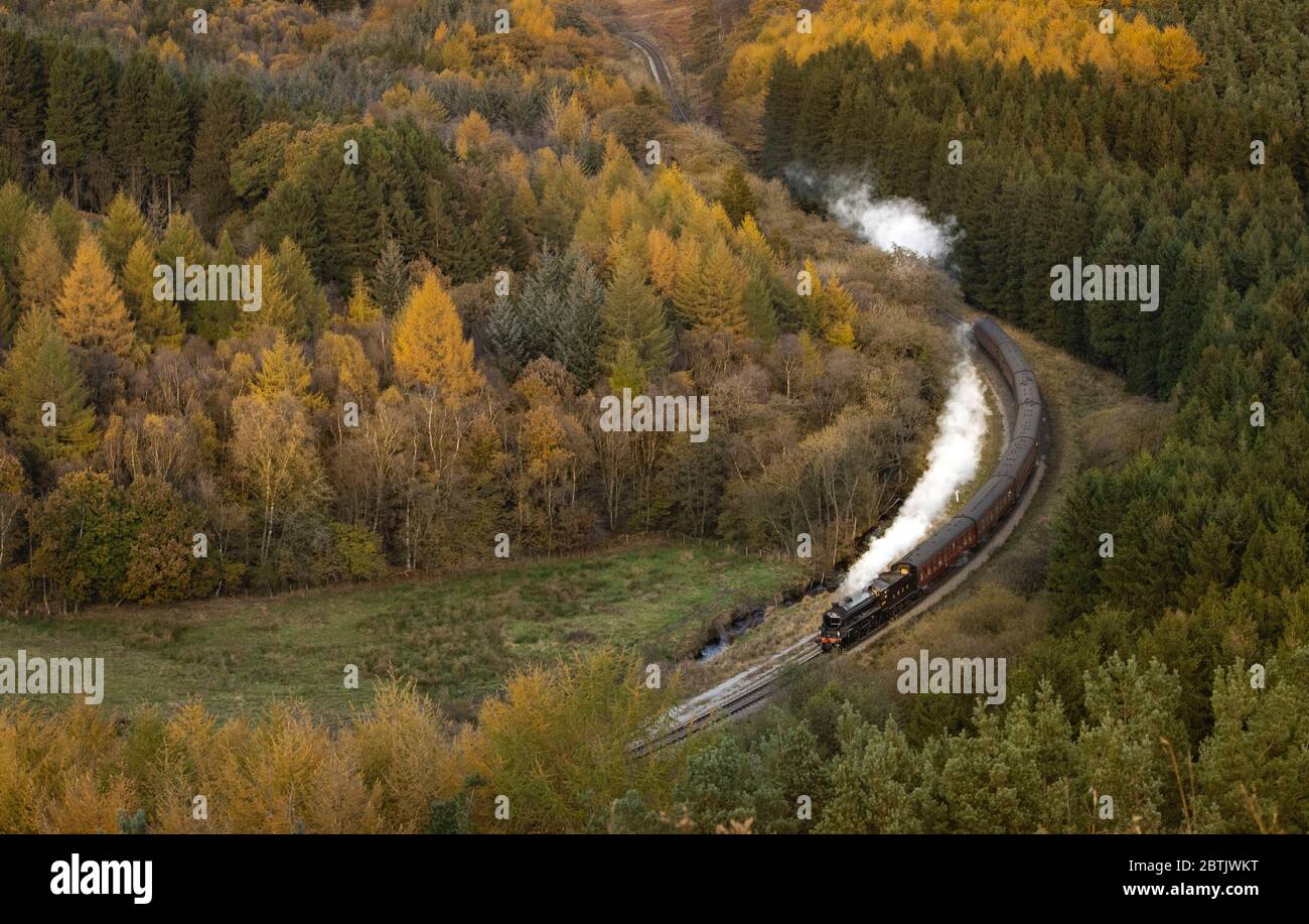 A steam train pictured running on the North Yorkshire Moors Railway ...