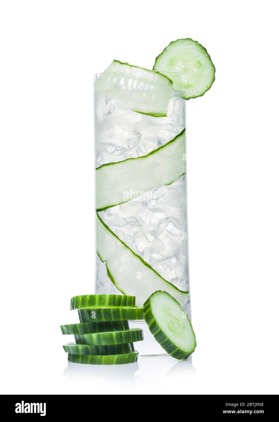 Fresh cold cucumber water in highball glass with ice cubes and cucumber ...