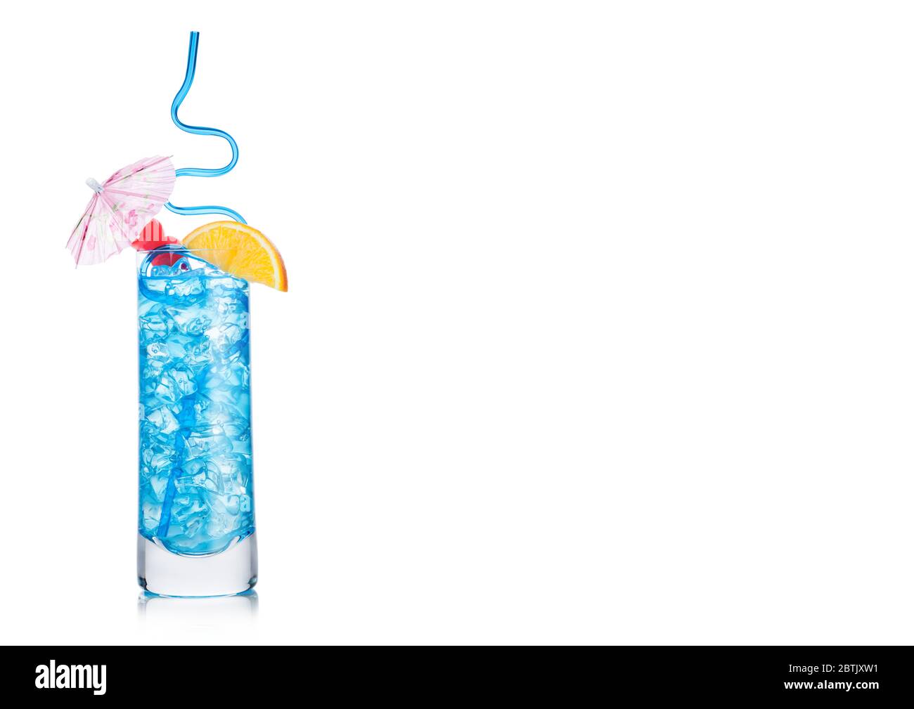 Blue lagoon cocktail highball glass with straw and orange slice with ...