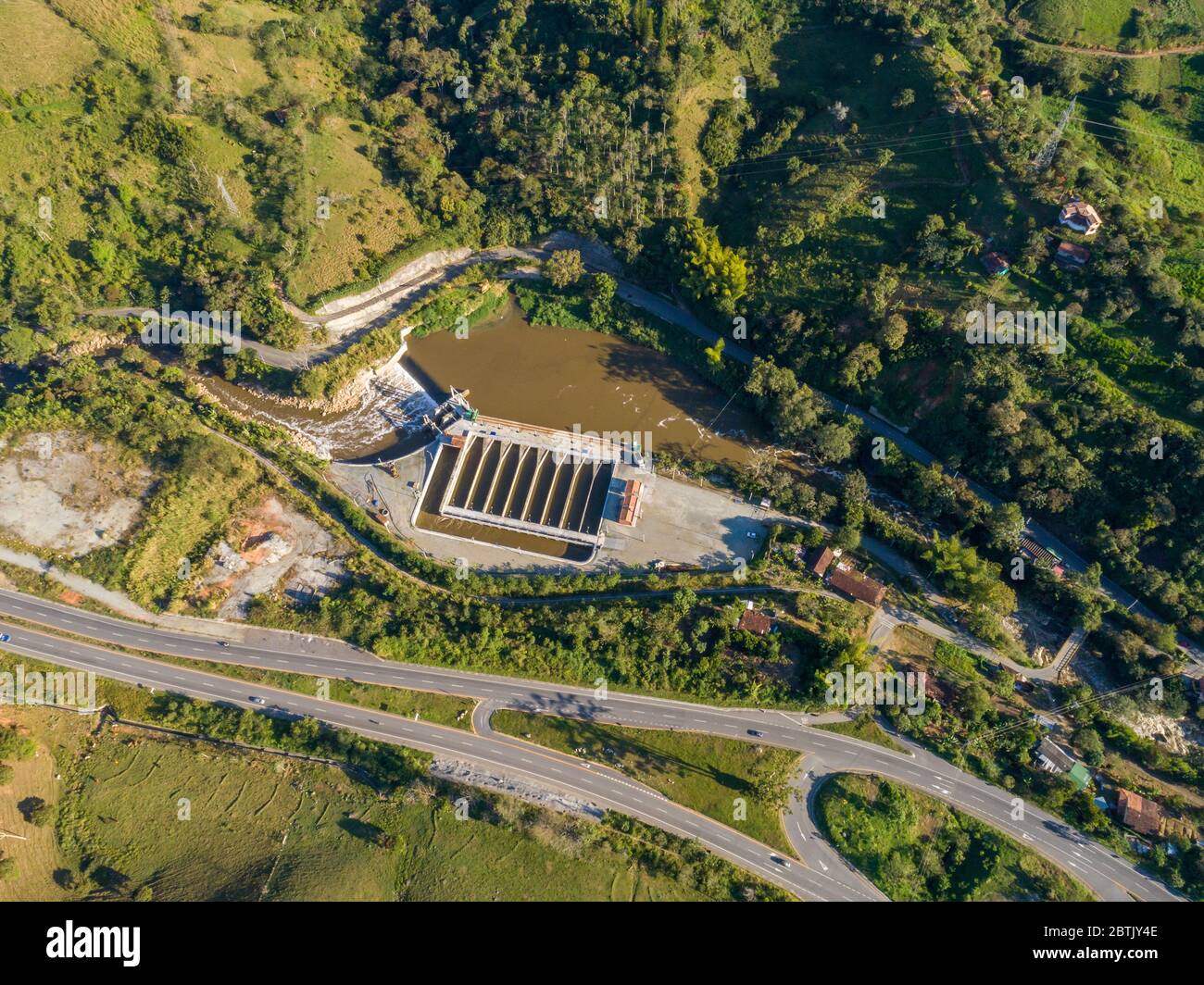 Aerial view of an hydroelectric generation plant in the middle of the ...
