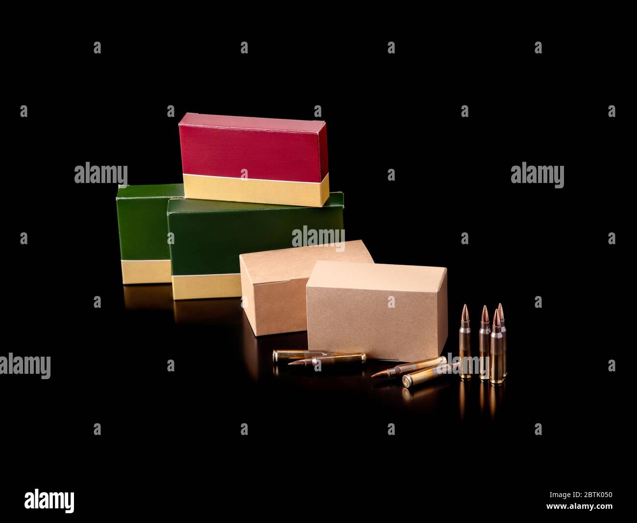 Cartridges for a rifle on a dark background. Different boxes with ...