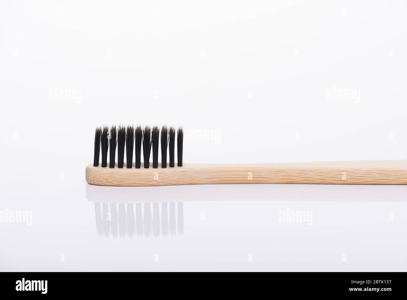 Close-up macro side profile view photo of eco-friendly toothbrush with ...