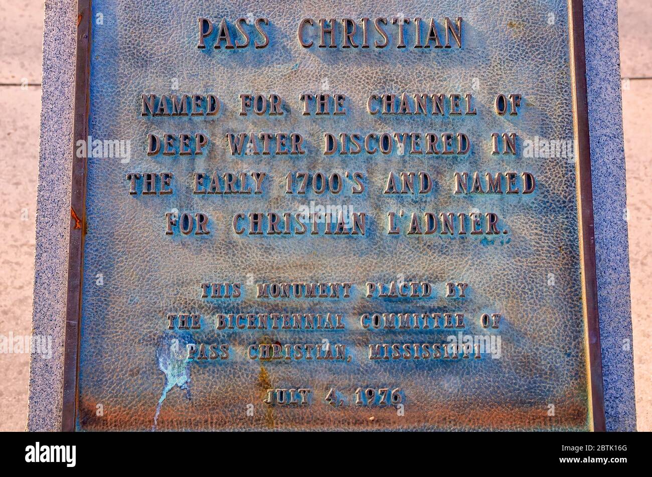A historic plaque in front of Pass Christian City Hall tells the story ...