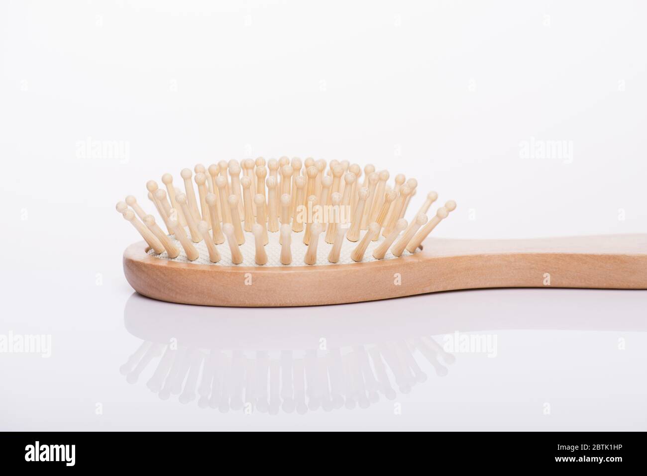 Close-up side profile view cropped photo of eco-friendly comb brush ...