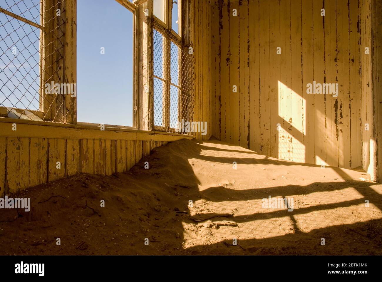 stunning interior dunes come through windows and door Stock Photo - Alamy