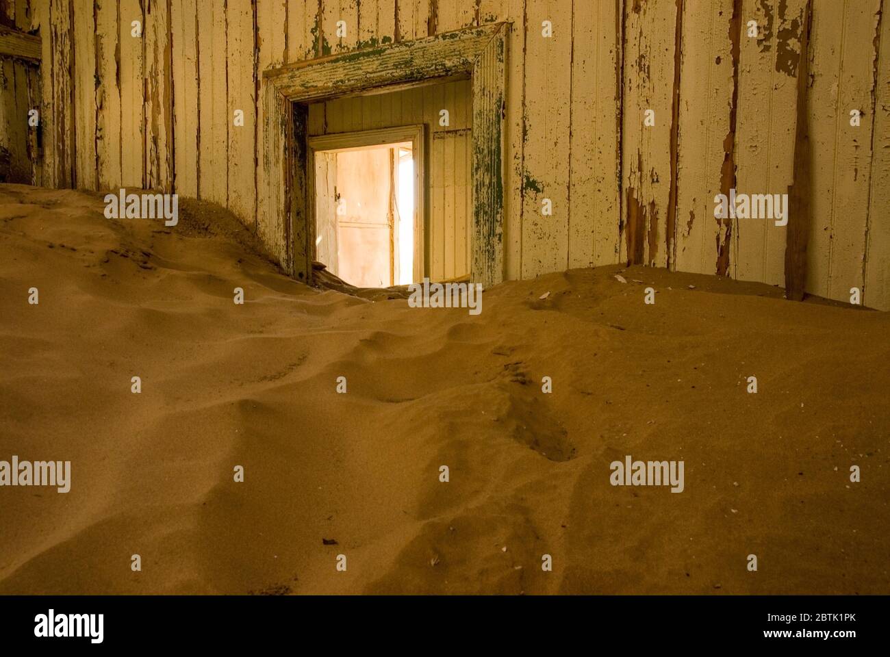 stunning interior dunes come through windows and door Stock Photo - Alamy