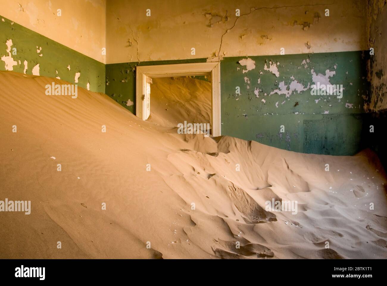 stunning interior dunes come through windows and door Stock Photo - Alamy
