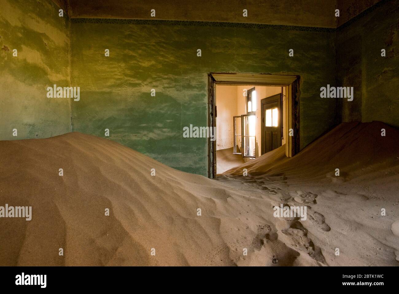 stunning interior dunes come through windows and door Stock Photo - Alamy
