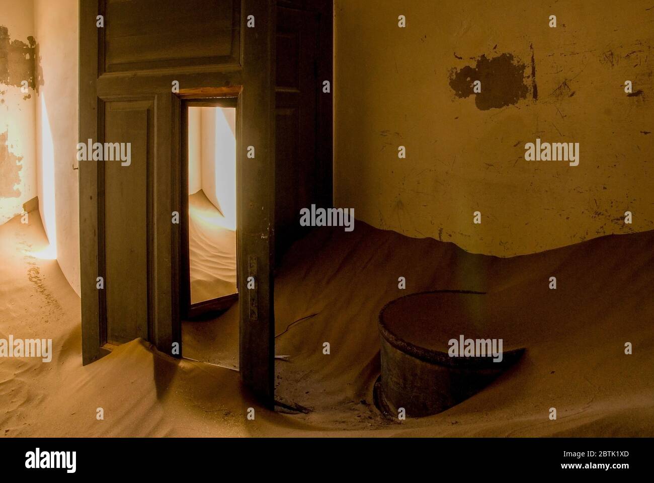 stunning interior dunes come through windows and door Stock Photo - Alamy