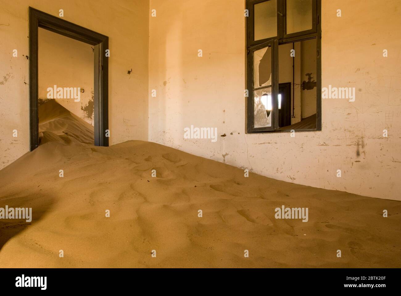 stunning interior dunes come through windows and door Stock Photo - Alamy