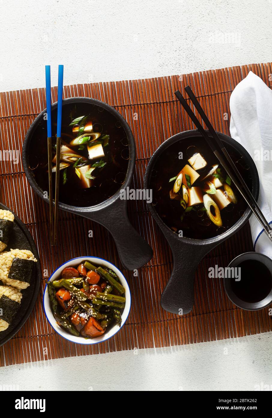 Japanese breakfast with miso soup, onigiri and vegetables in sweet and ...