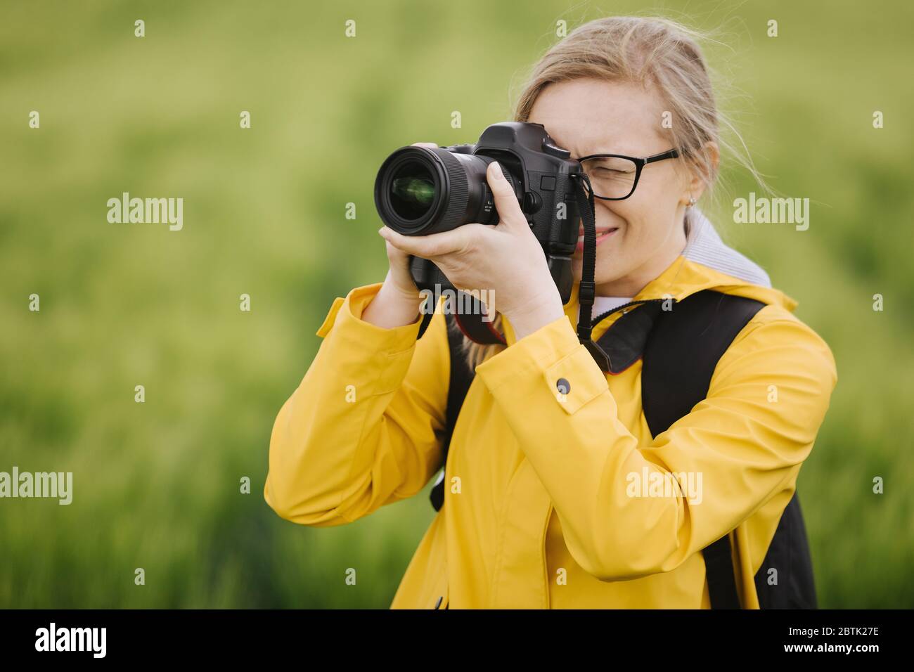 Photographer taking pictures of beautiful nature around Stock Photo - Alamy