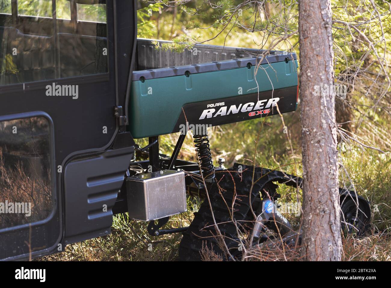Side view of a Polaris Ranger UTV / ATV with tracks Stock Photo - Alamy