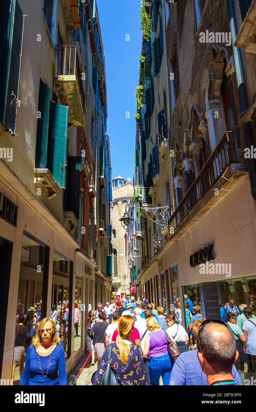 View of the ively overcrowded main street of Venice- the Merceria,lined ...