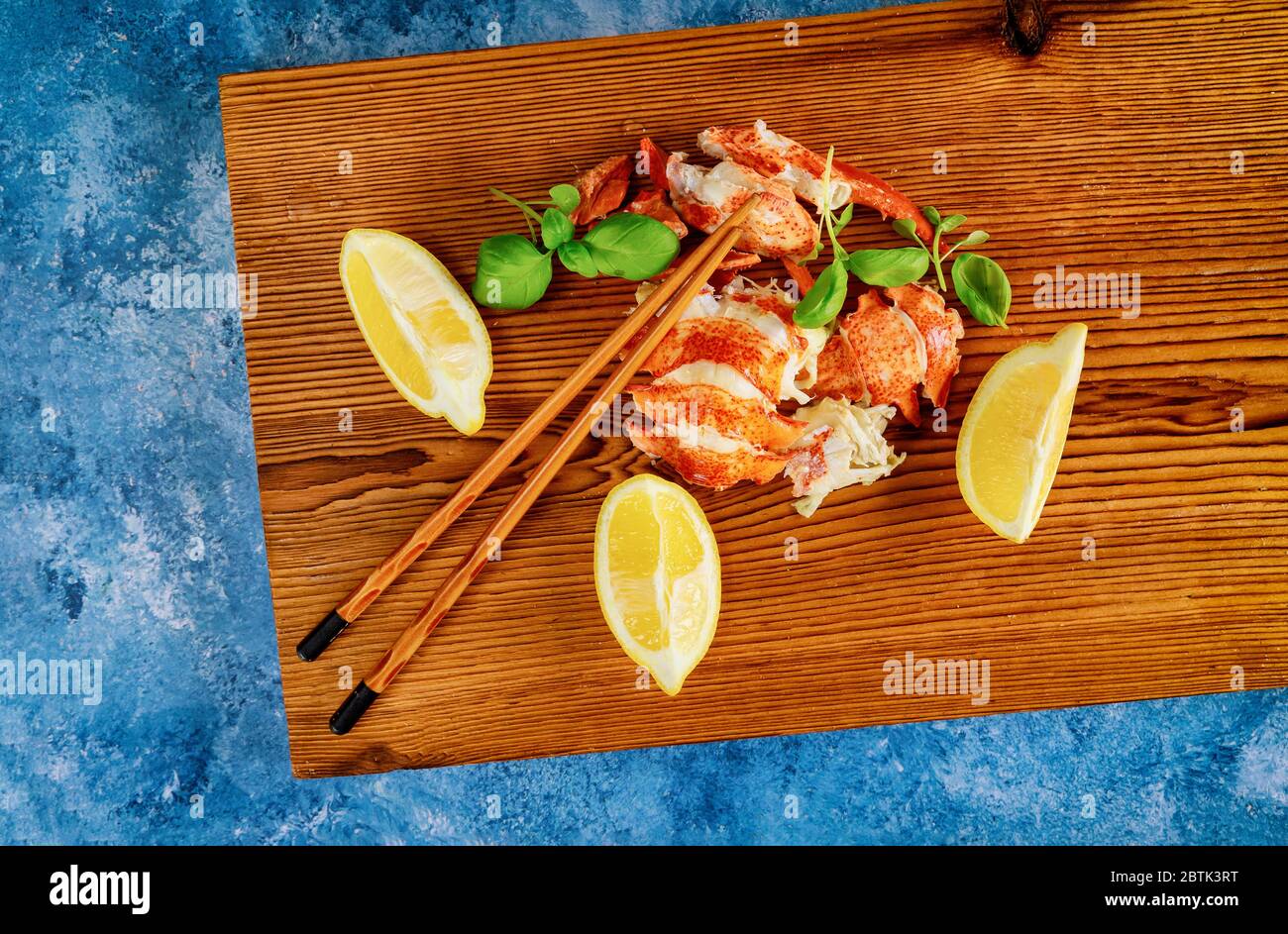 Dinner with boiled ready to eat meat lobster pieces in the table with ...