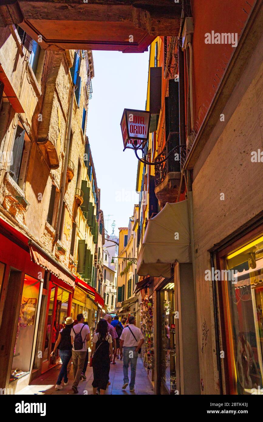 View of the ively overcrowded main street of Venice- the Merceria,lined ...