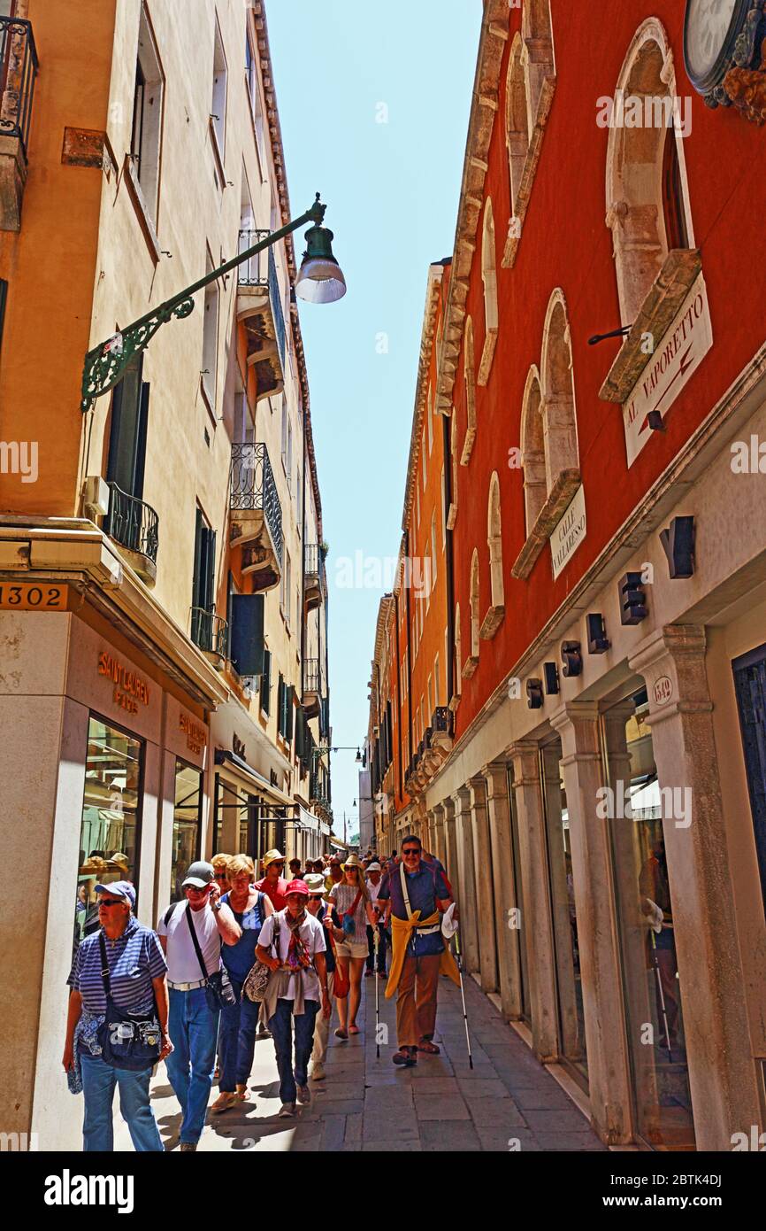 Venice,Veneto/Italy-June 7th 2016: Merceria-narrow street,lined up with ...