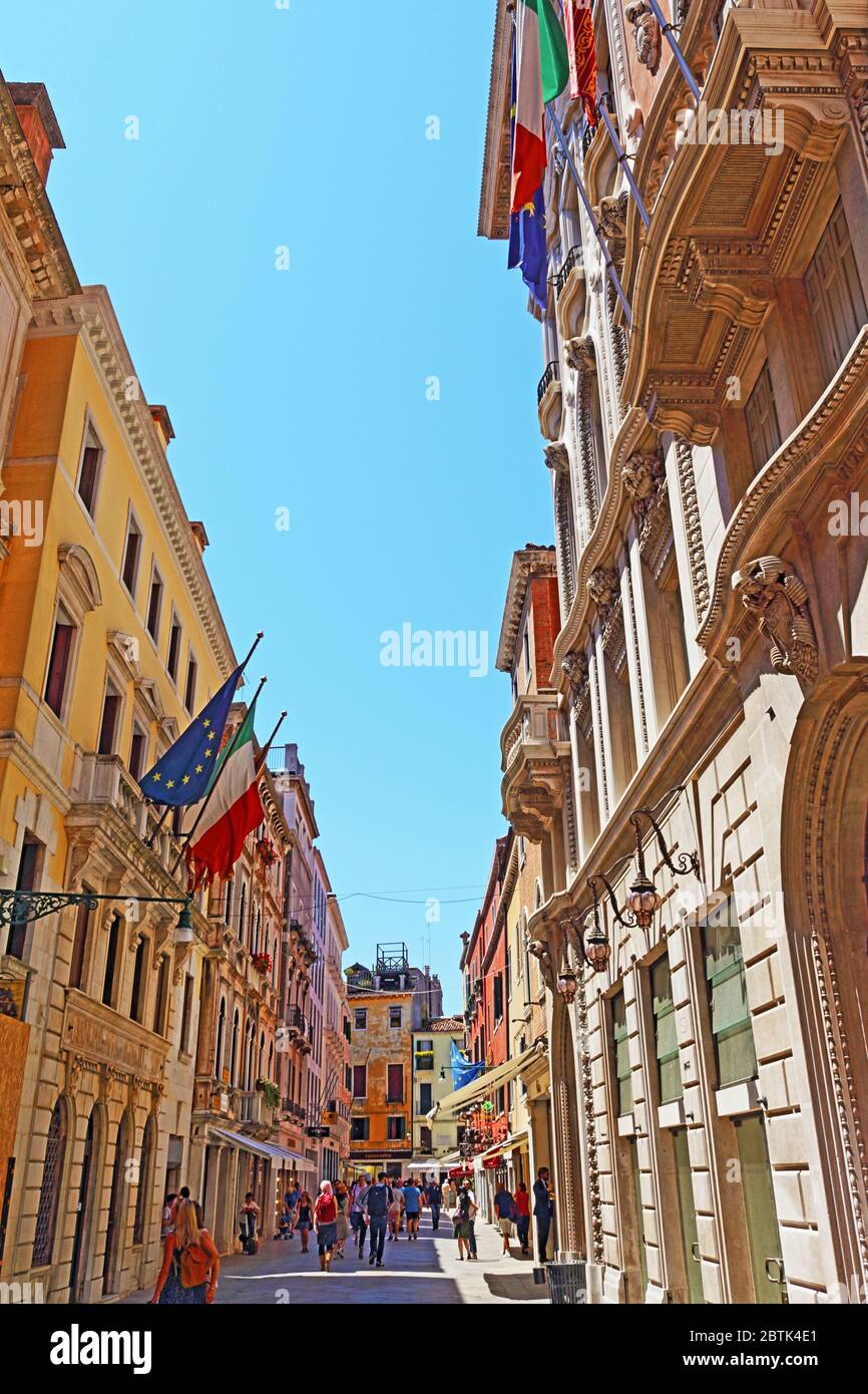 Tourists shopping and emjoying the picturesque views of the quaint ...