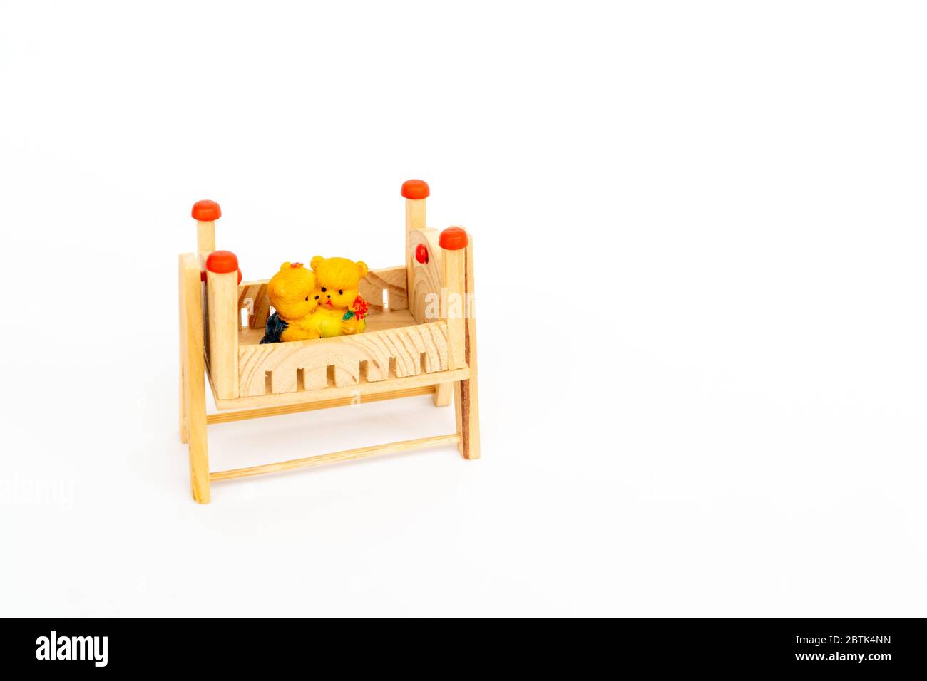 Toy teddy bears sit toy beds. Toy wooden bed. Wooden toy bed with a ...