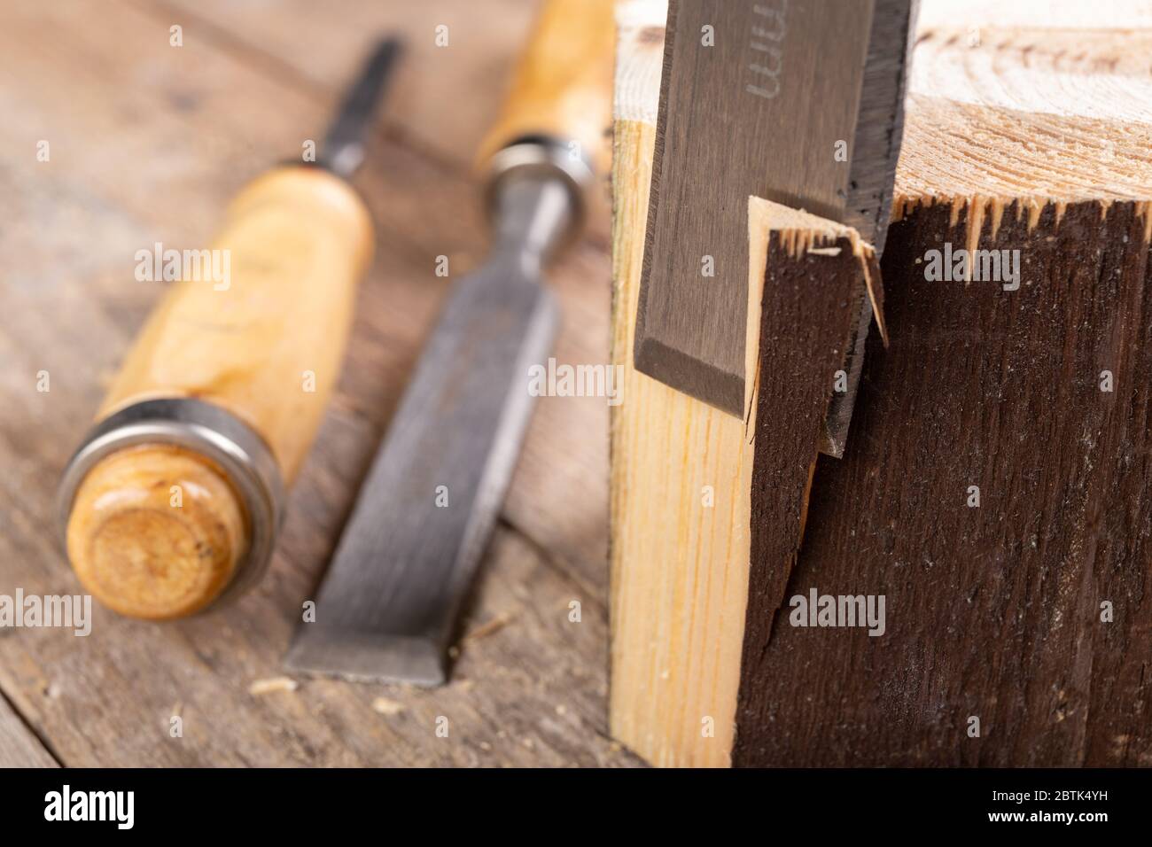 Work with a carpenter's chisel in pine wood. Small carpentry work in ...