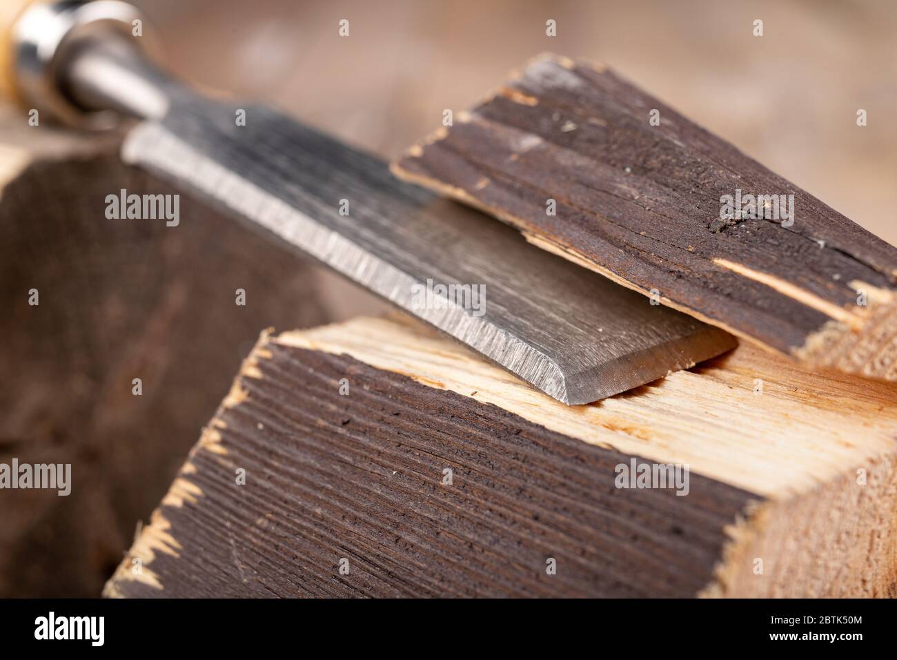 Work with a carpenter's chisel in pine wood. Small carpentry work in ...