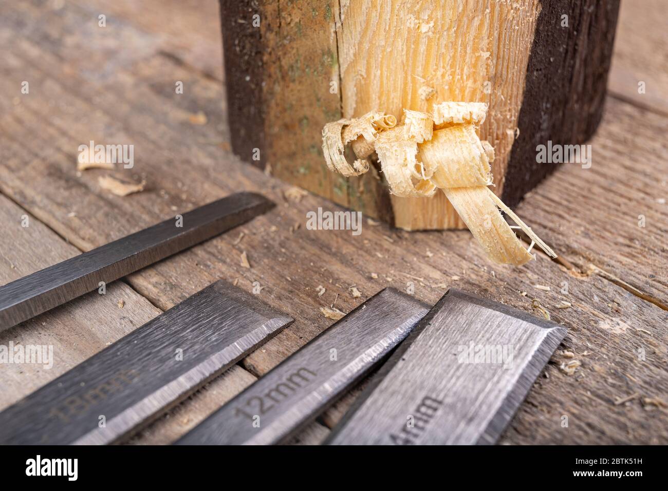 Work with a carpenter's chisel in pine wood. Small carpentry work in ...
