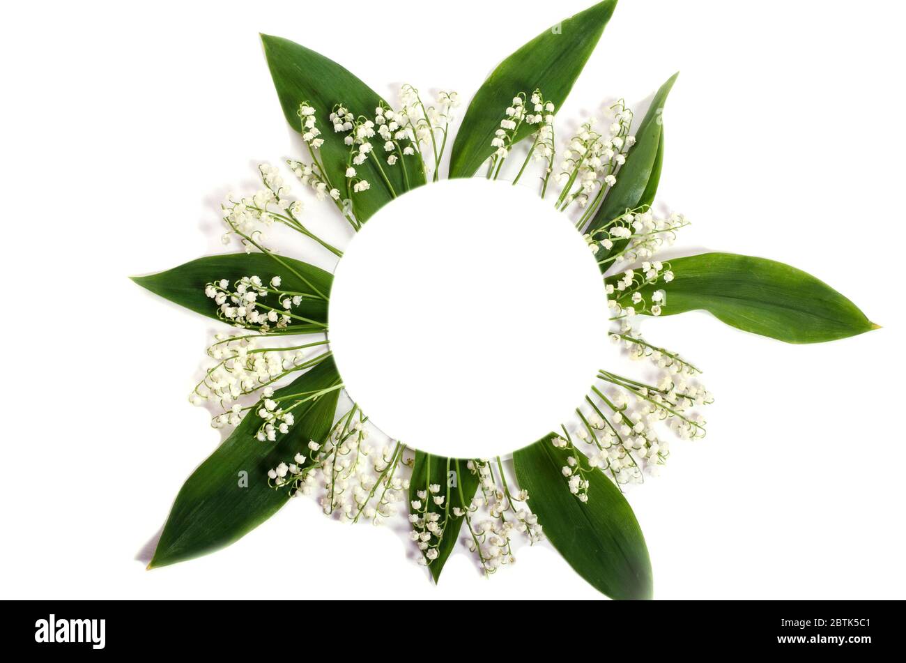 Blooming lilies of the valley in the form of a round frame isolated on ...