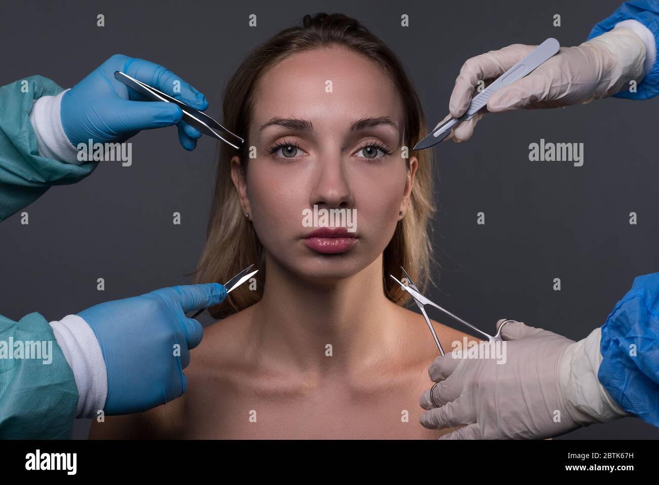 Close-up studio portrait of a young beautiful blonde girl, in a medical ...