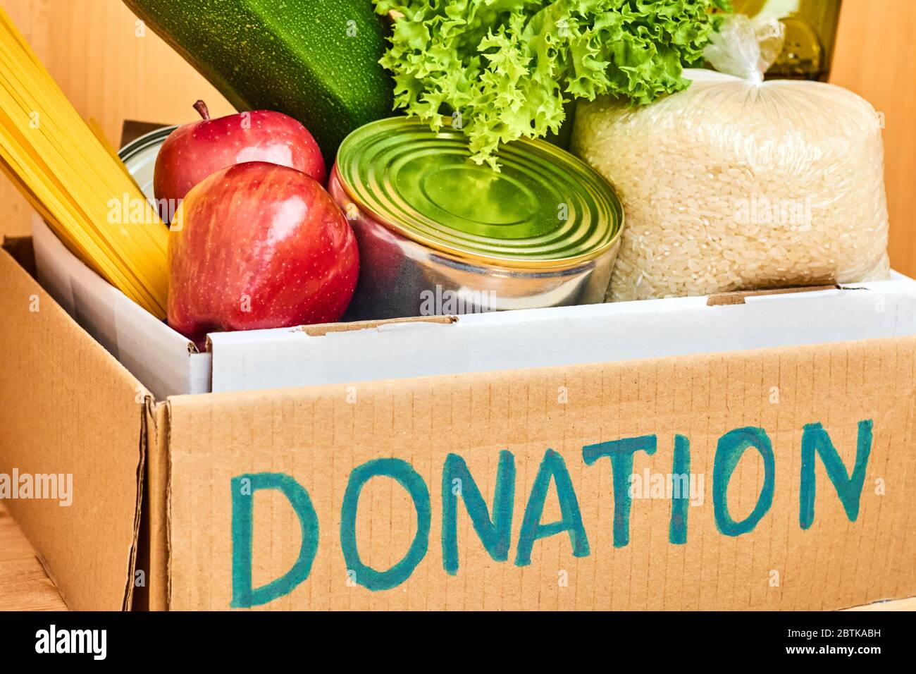 Donation cardboard box with various food, vegetables, fruits, cereals ...