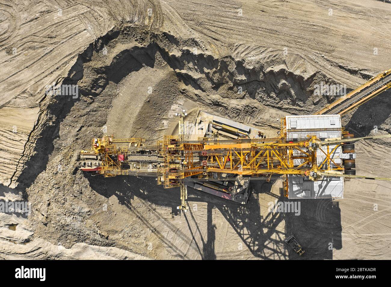 Aerial view of large heavy equipment machine mining natural resource ...
