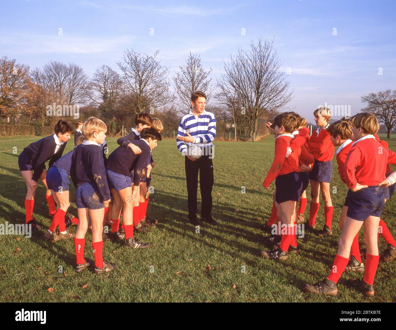 Teacher coach coaching union boys scrummaging against scrum at s hi-res ...