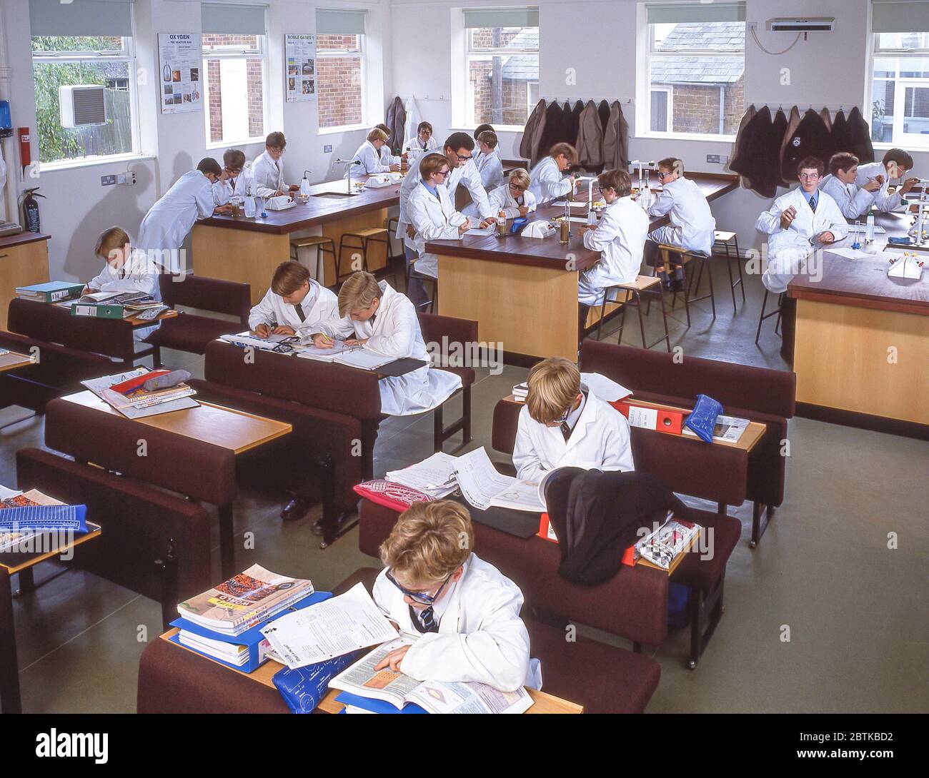 Teacher and students in science class, Surrey, England, United Kingdom ...