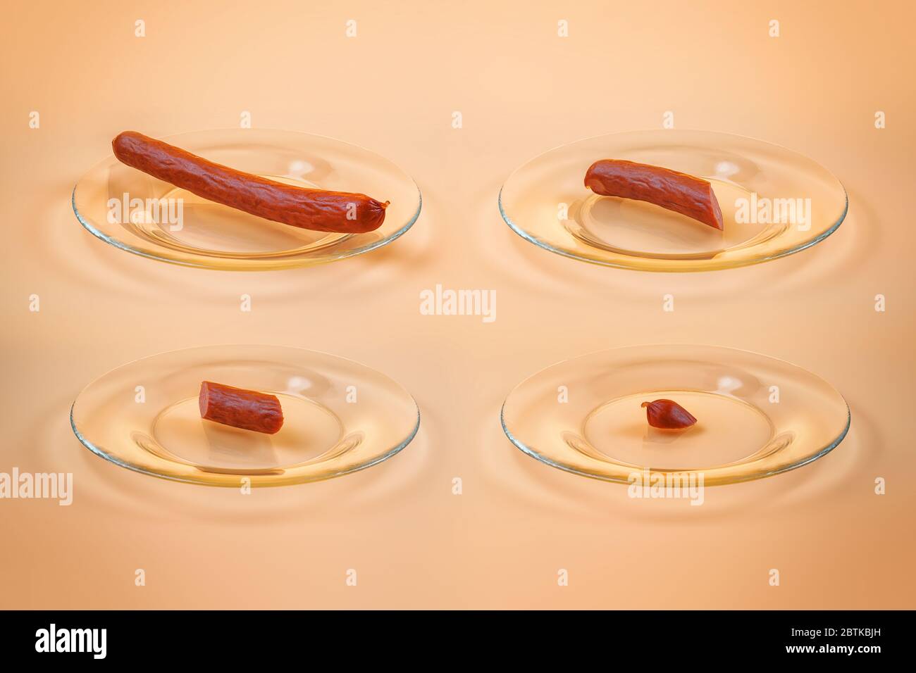 Four plates with four sausages pieces: big one and three decreasing to ...