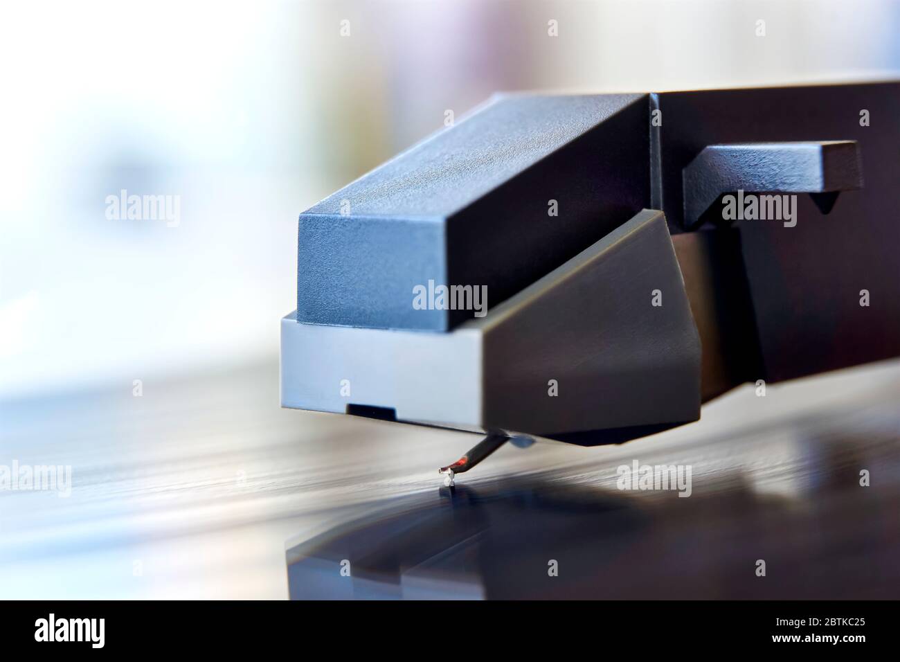 Extreme closeup of turntable record player with stylus in focus. Retro ...