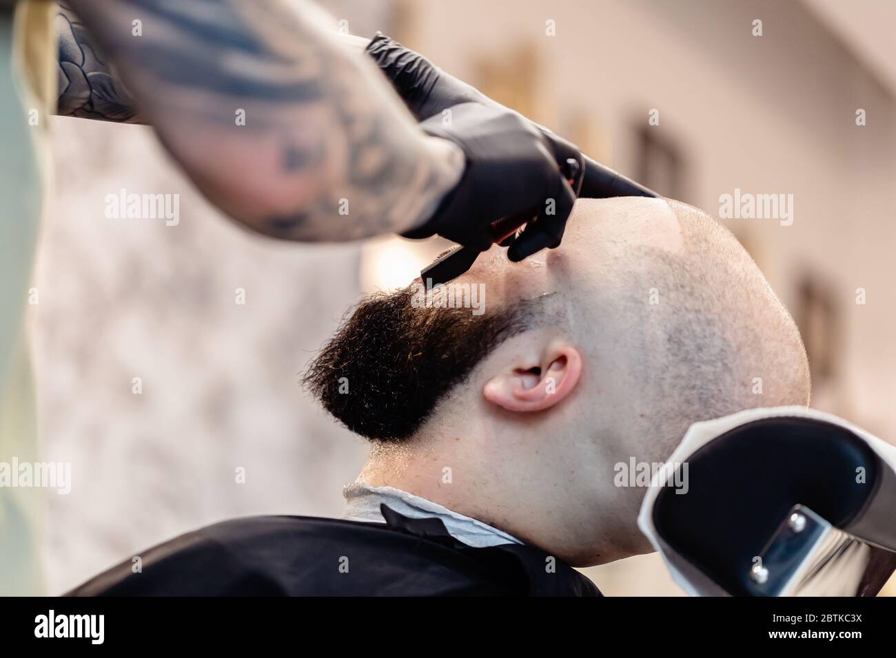 Beard haircut in a barber shop. Beard care Stock Photo - Alamy