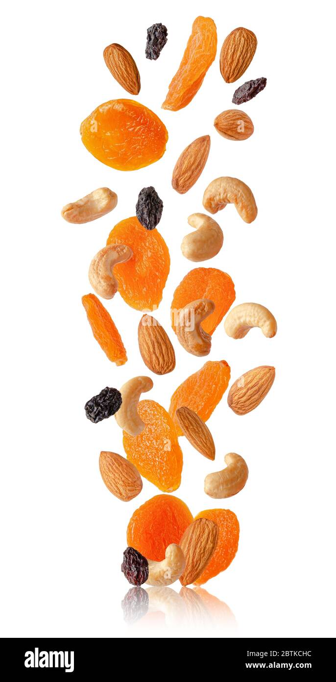 Flying dry fruits and nuts isolated on white Stock Photo - Alamy