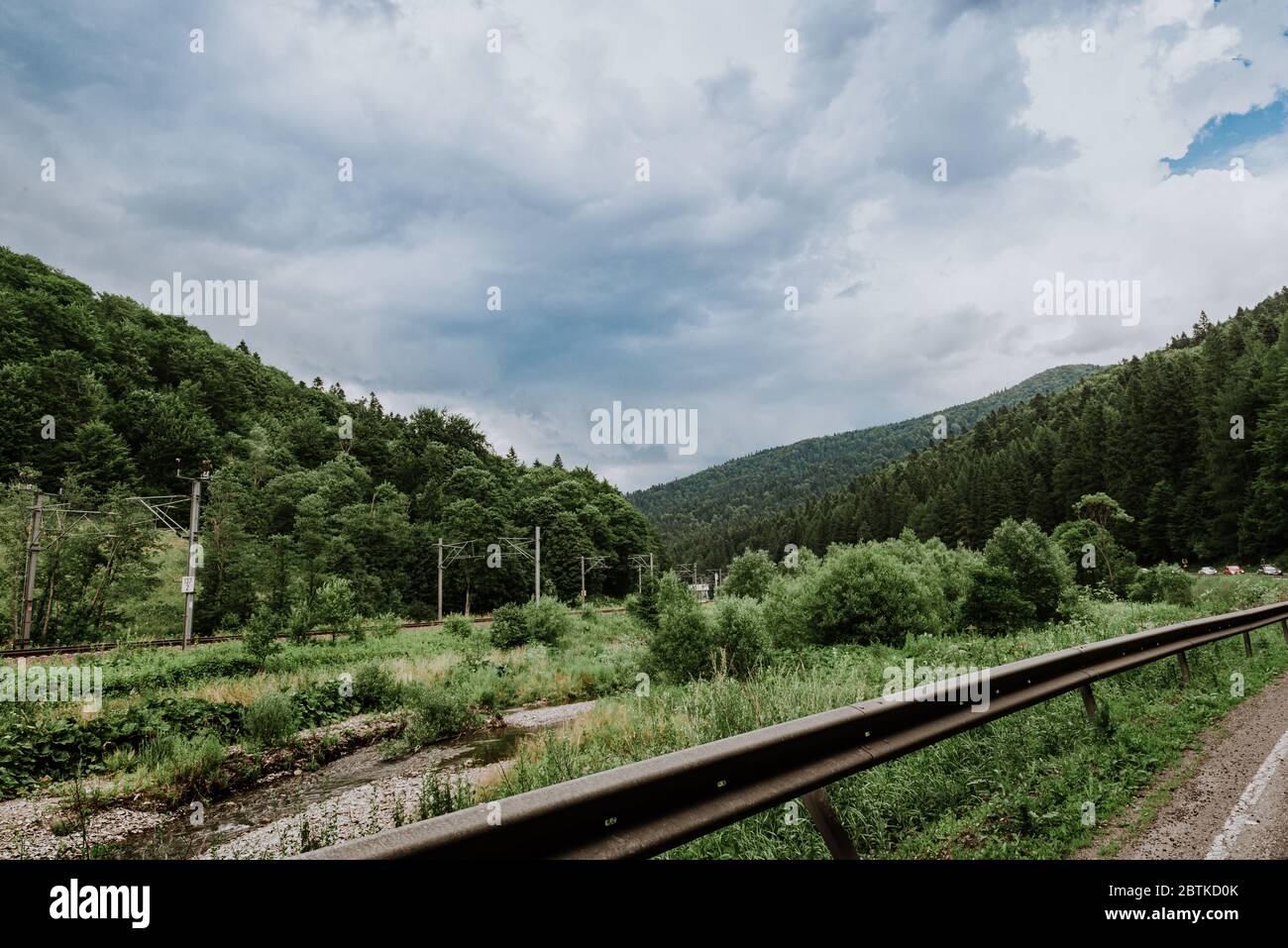 Panoramic view of river and mountain while a train is passing by Stock ...