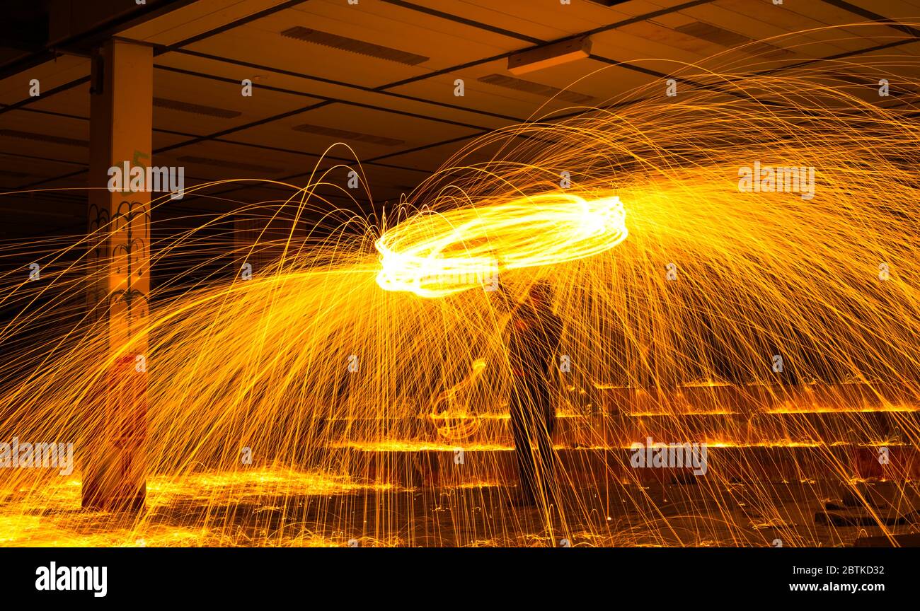Steel wool spinning in a lost place Stock Photo - Alamy