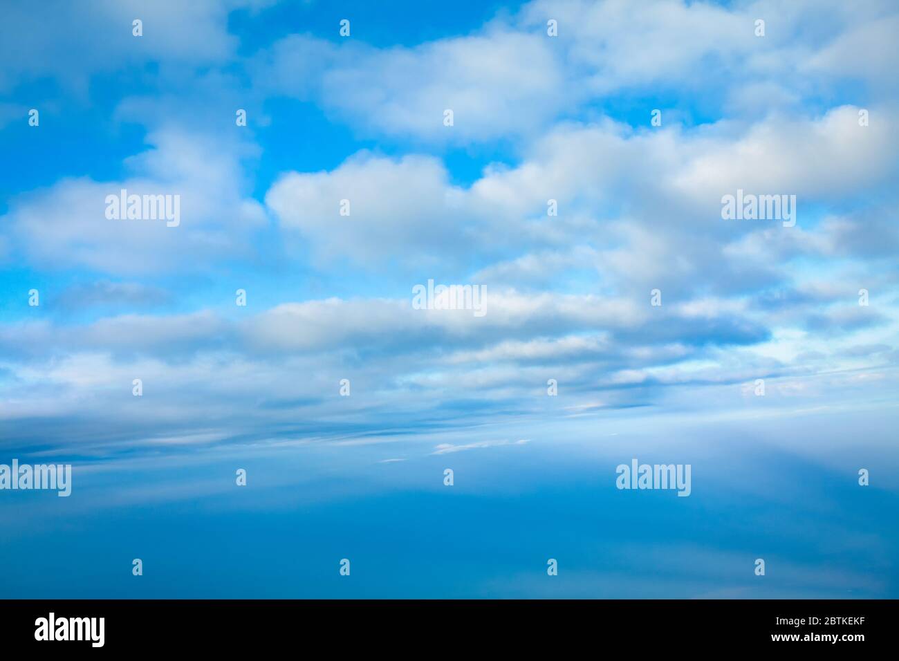 flying under the blue sky clouds Stock Photo - Alamy