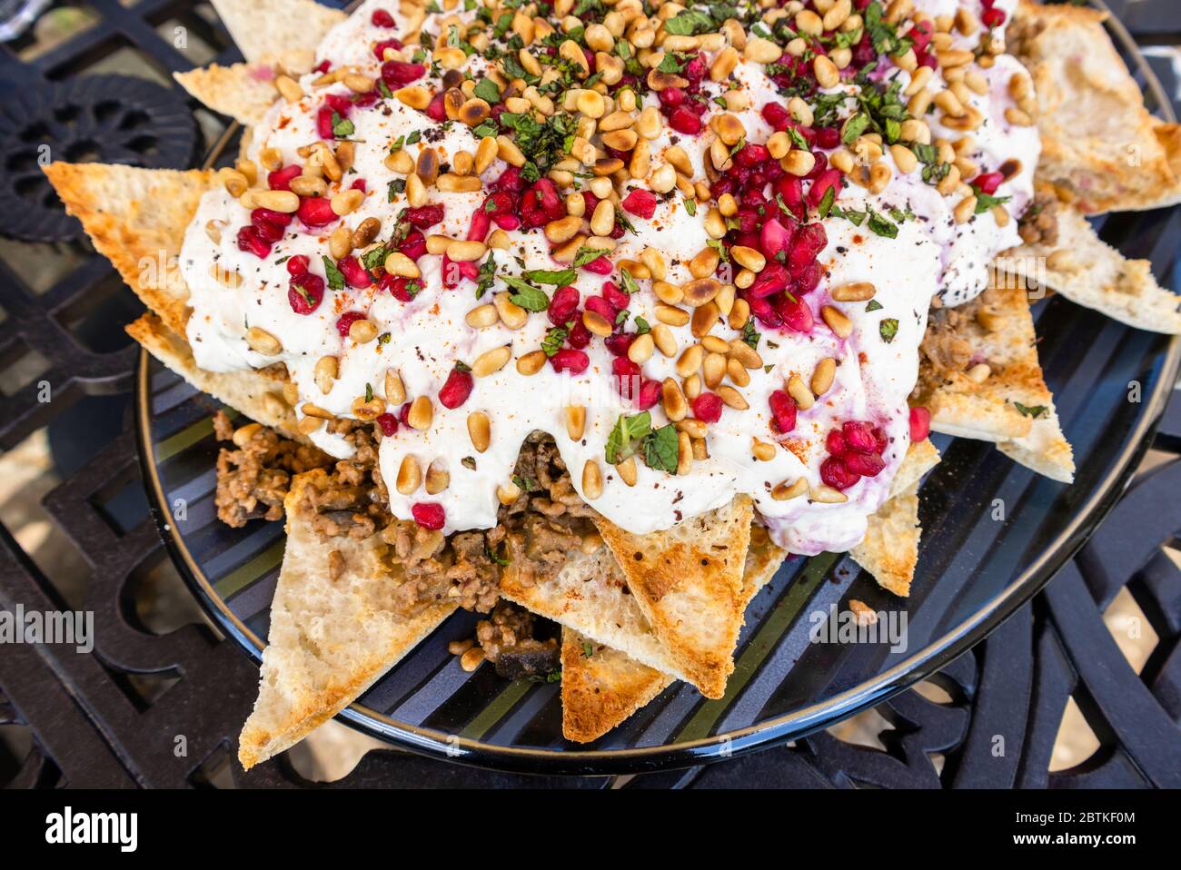 A plate of beef and aubergine fatteh, a traditional middle eastern dish ...