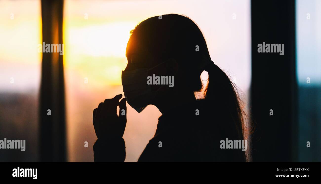 Coronavirus mask woman touching her medical surgical mask with hands ...