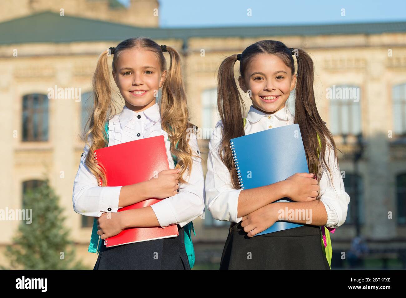 Life is better with true friends. School friends hold books. Happy ...