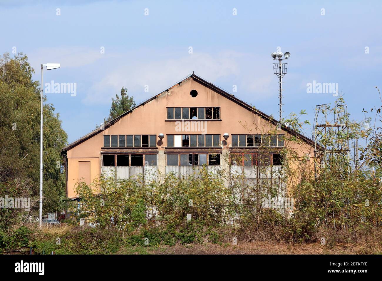 Destroyed abandoned old railway station building with broken windows ...