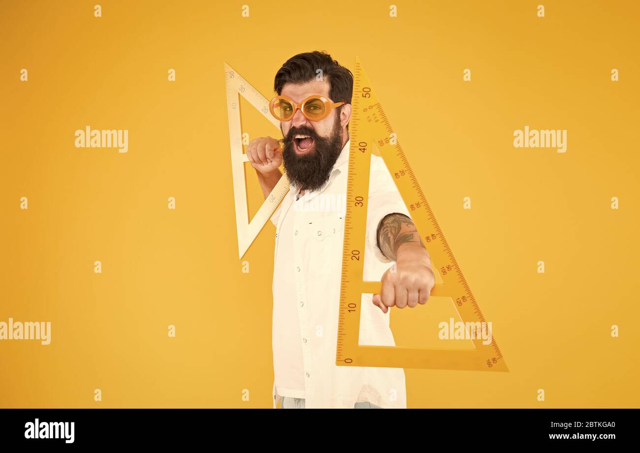 Smart student. Geometry teacher. Student using measuring instrument ...