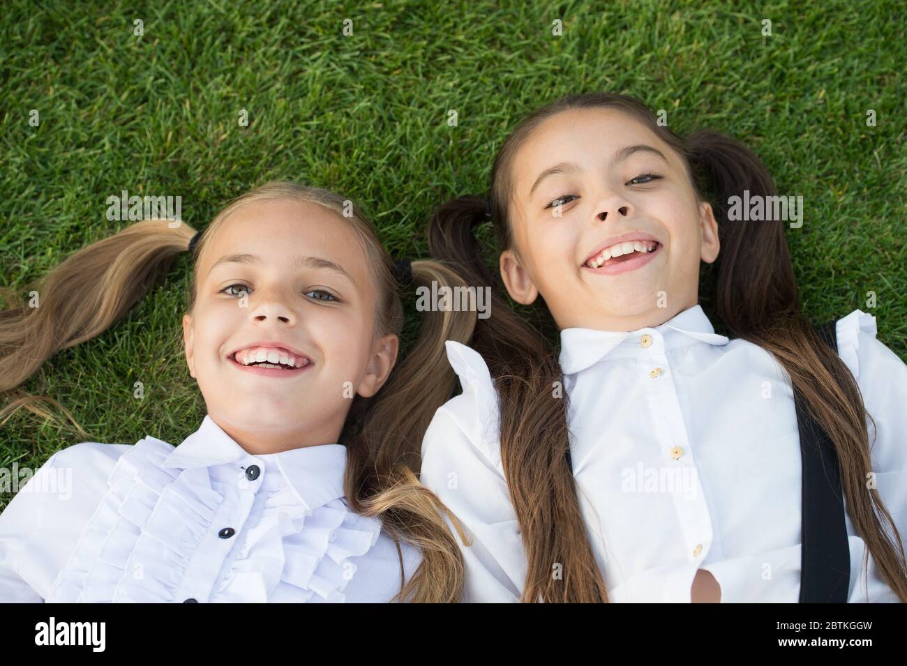 Happy childhood experience. Happy children relax on green grass ...