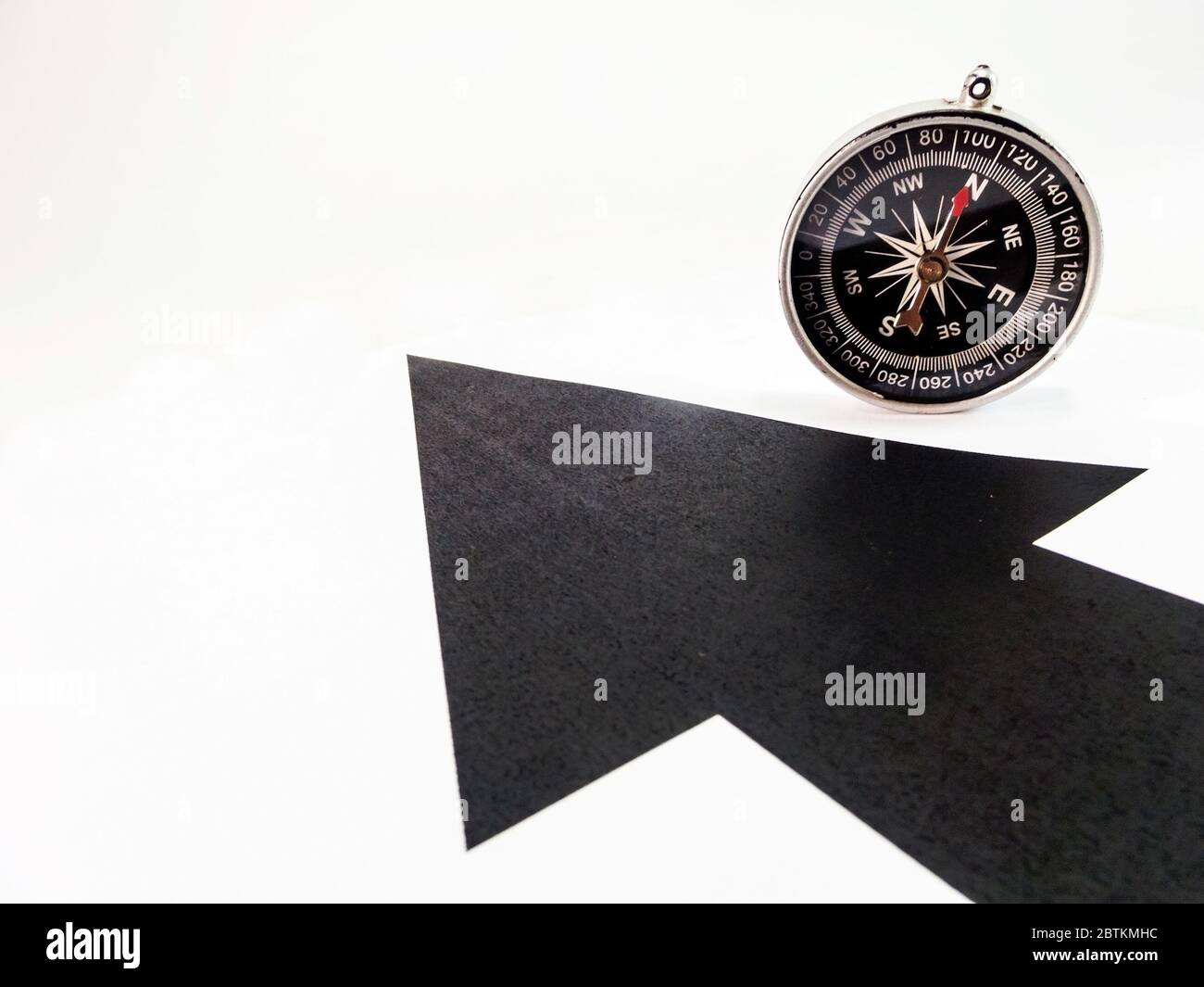 Compass and black arrow symbols on a white background Stock Photo - Alamy